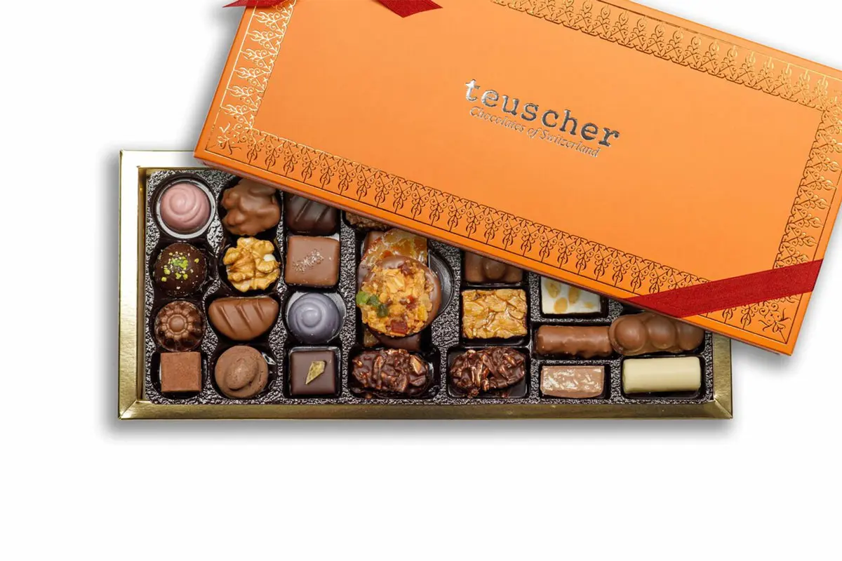 Teuscher标志设计含义及巧克力品牌设计理念-诗宸标志设计